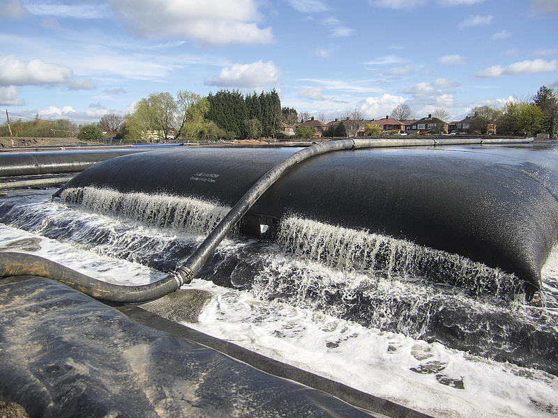 Sludge dewatering with geotextile containers/tubes